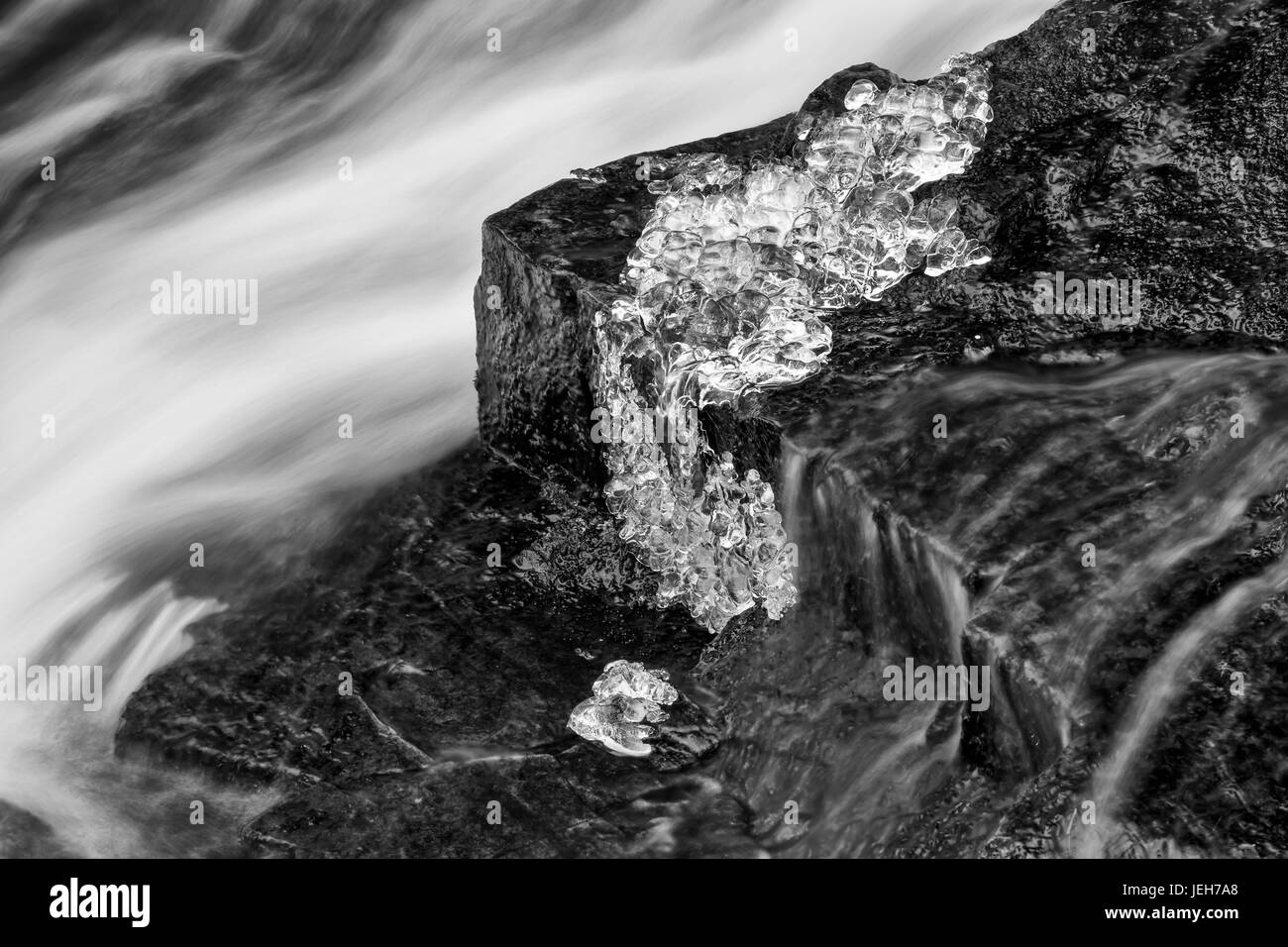 A brook flowing out of Hobsons Lake with ice on the wet rock, Birch ...