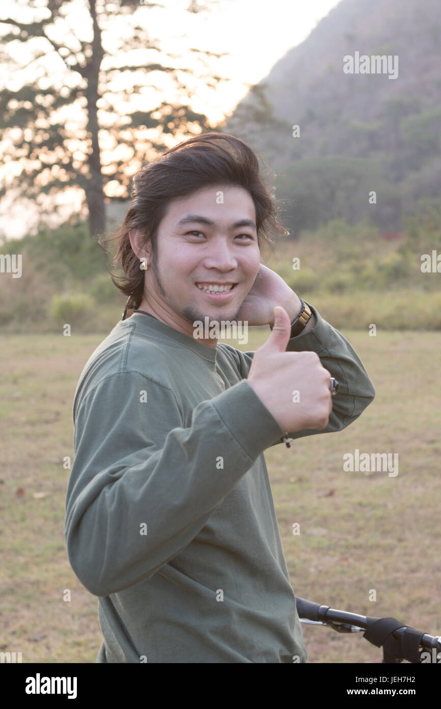 asian younger man toothy smiling face happiness emotion Stock Photo - Alamy