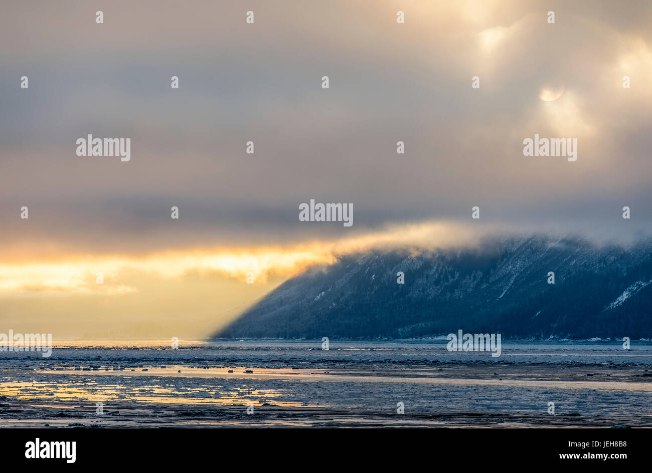 Low Altitude Clouds Are Cast In Warm Sunset Light Along Turnagain Arm ... Low Altitude Clouds Are Cast In Warm Sunset Light Along Turnagain Arm ...