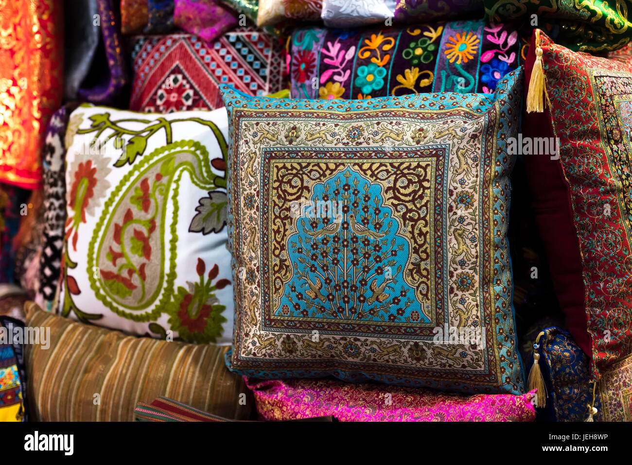Colourful decorative cushions on display at the Arab Market; Jerusalem ...