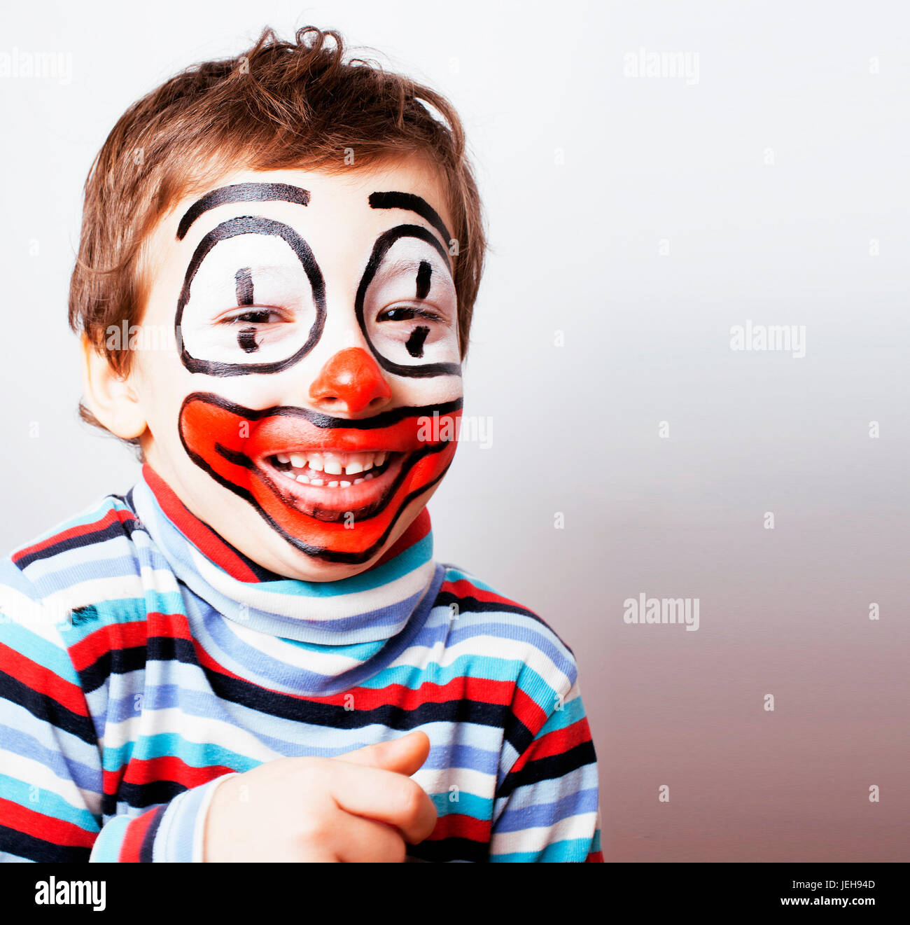little cute boy with facepaint like clown, pantomimic expression Stock ...