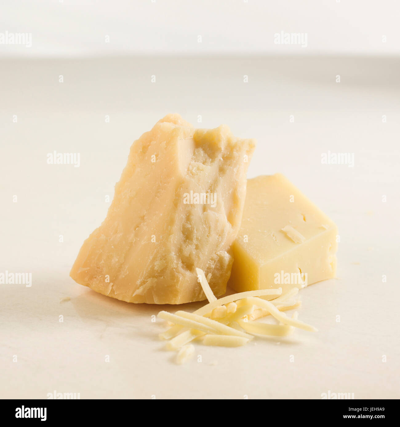 Parmesan cheese on a white background Stock Photo - Alamy