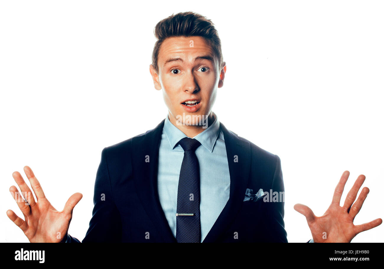 young handsoman businessman fooling aroung isolated on white background ...