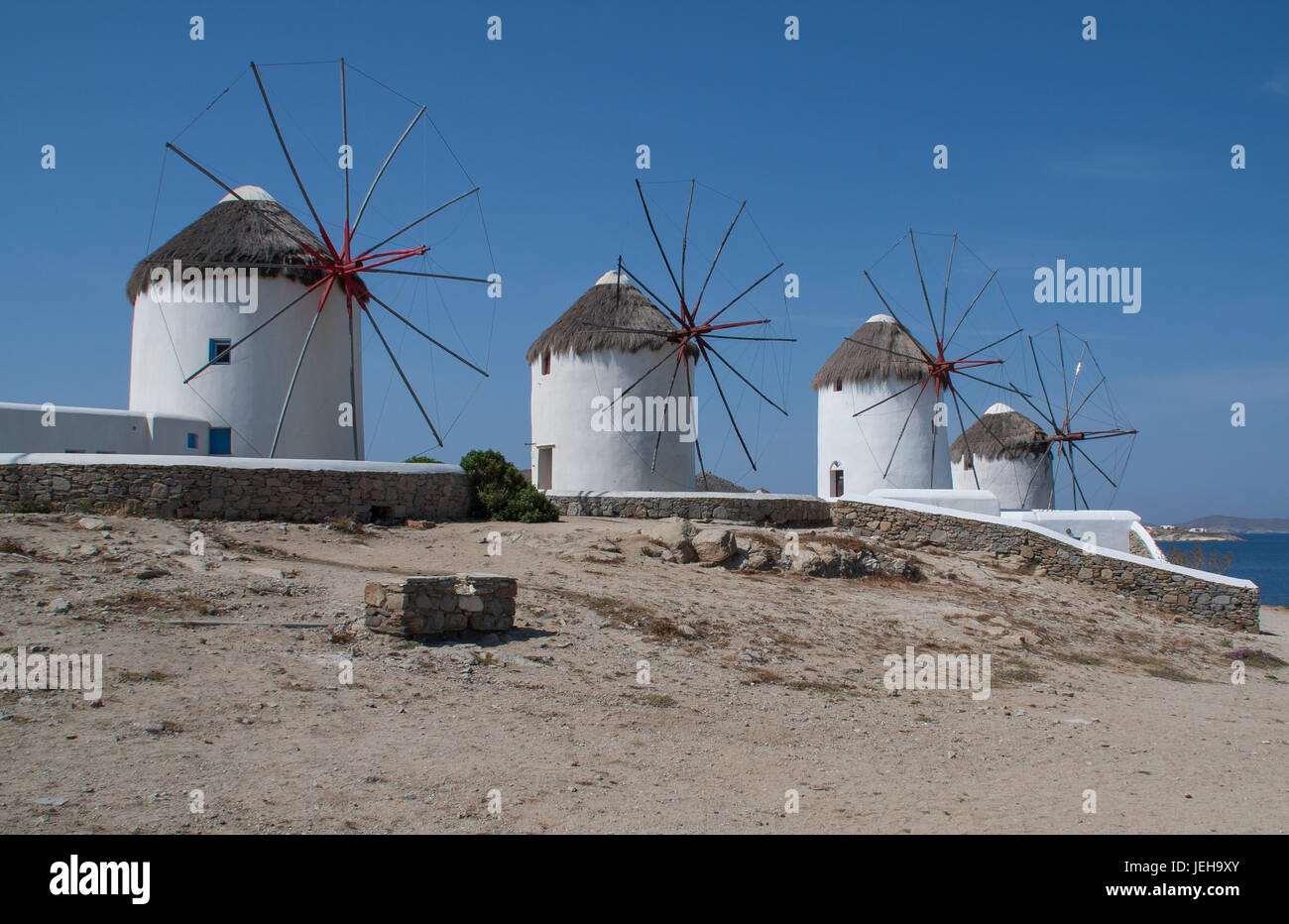 The 4 windmills of Santorini Stock Photo - Alamy