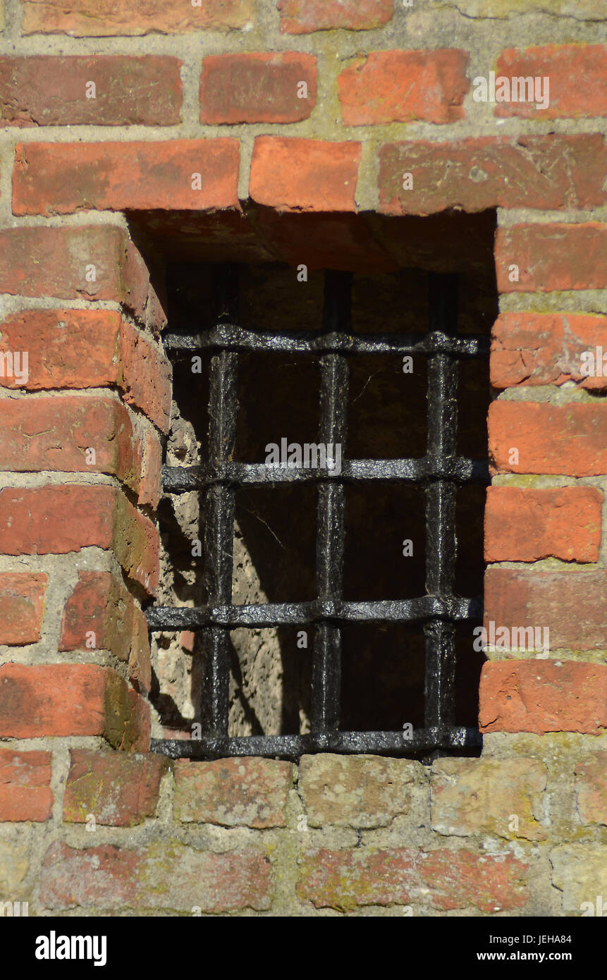 Small barred window of an old dungeon Stock Photo - Alamy