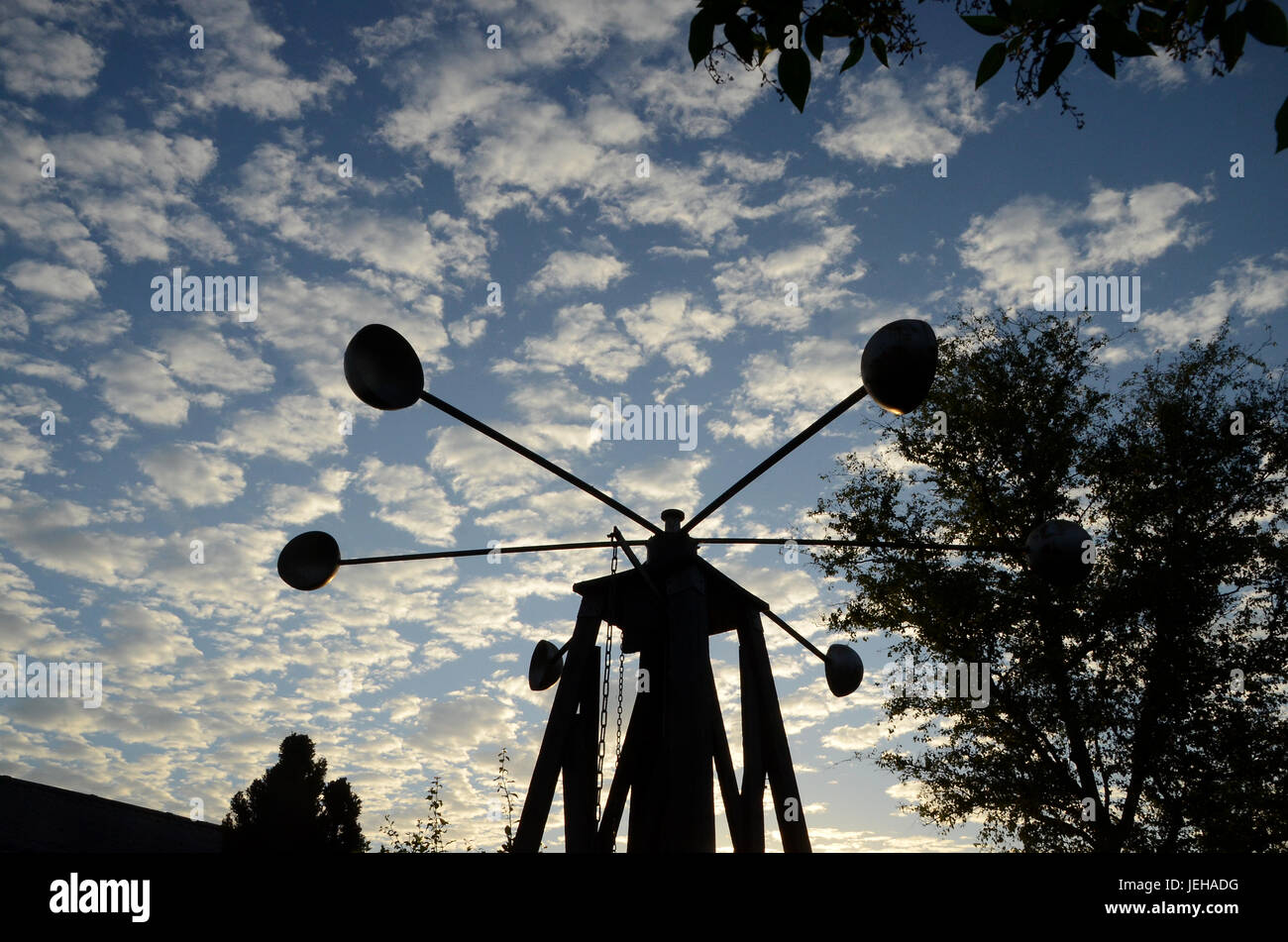Altucumulus clouds at sunrise, the landscape still lays in darkness ...