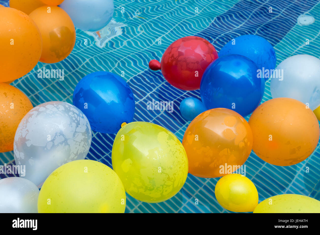 color balloons floating in a pool Stock Photo - Alamy
