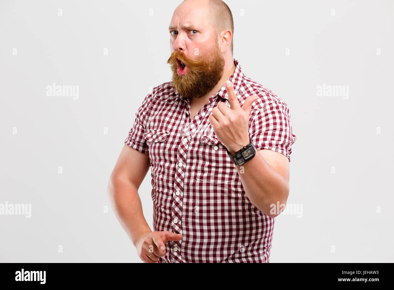 Surprised man shows one finger Stock Photo - Alamy