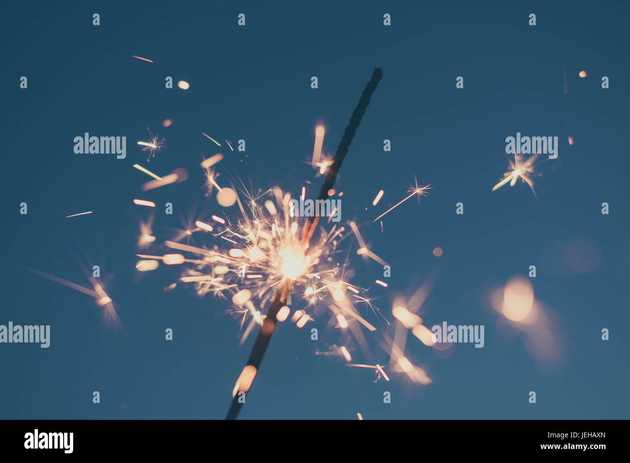 Burning Sparklers and Blue Sky Stock Photo - Alamy