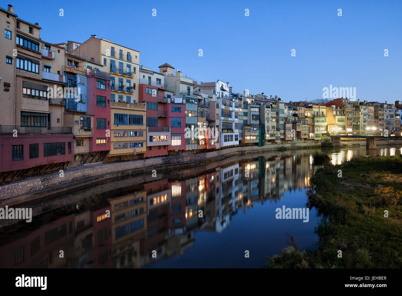 City of Girona cityscape and skyline at dusk, Old Town waterside houses ...