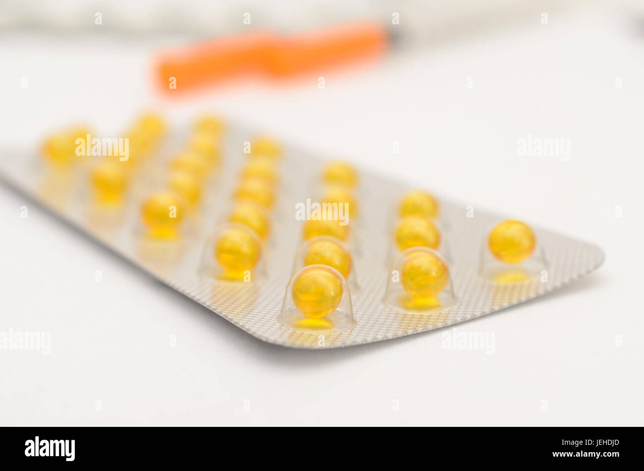 Contraceptive tablets in packages and without on a light background ...