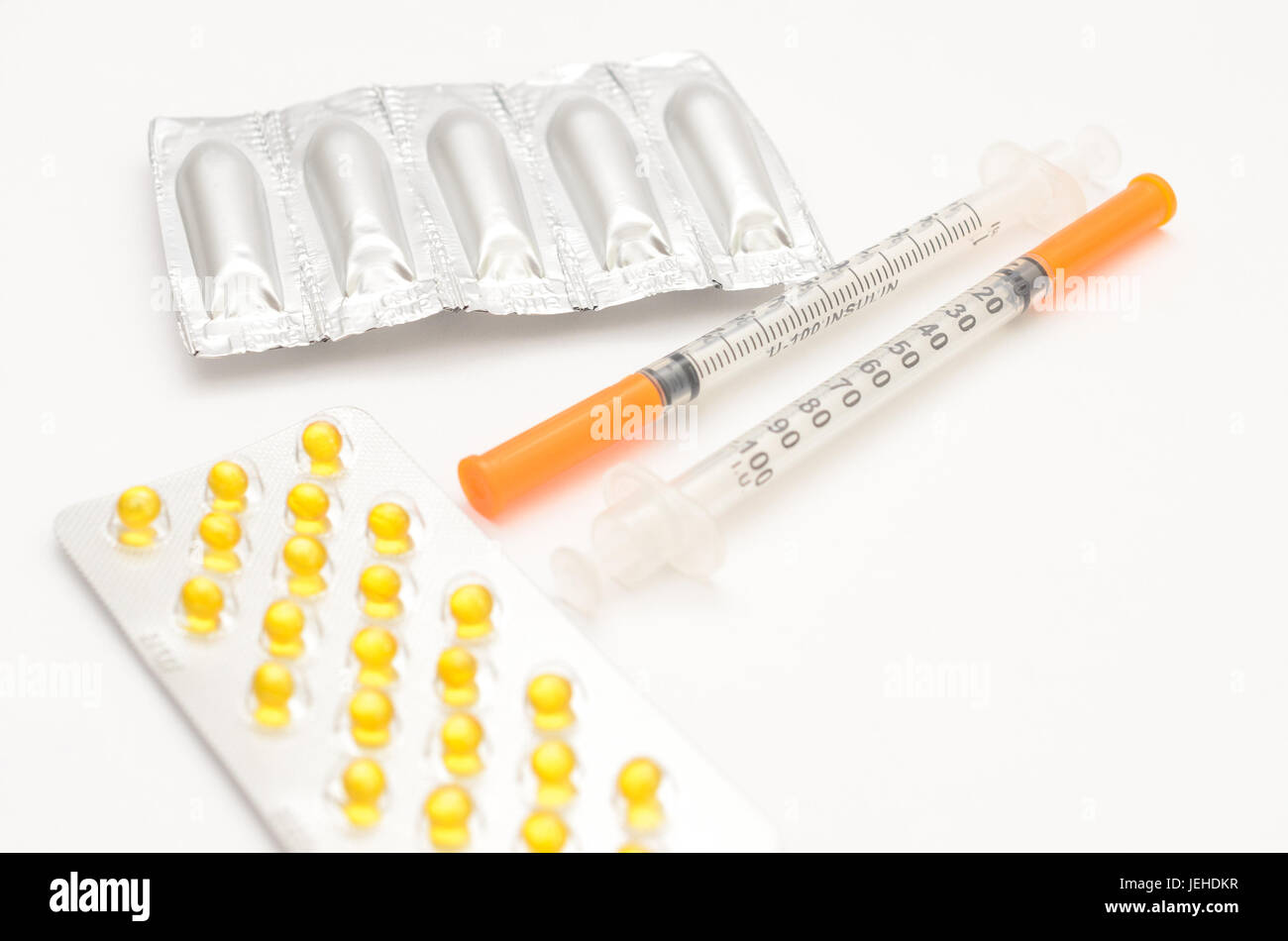 Contraceptive tablets in packages and without on a light background ...