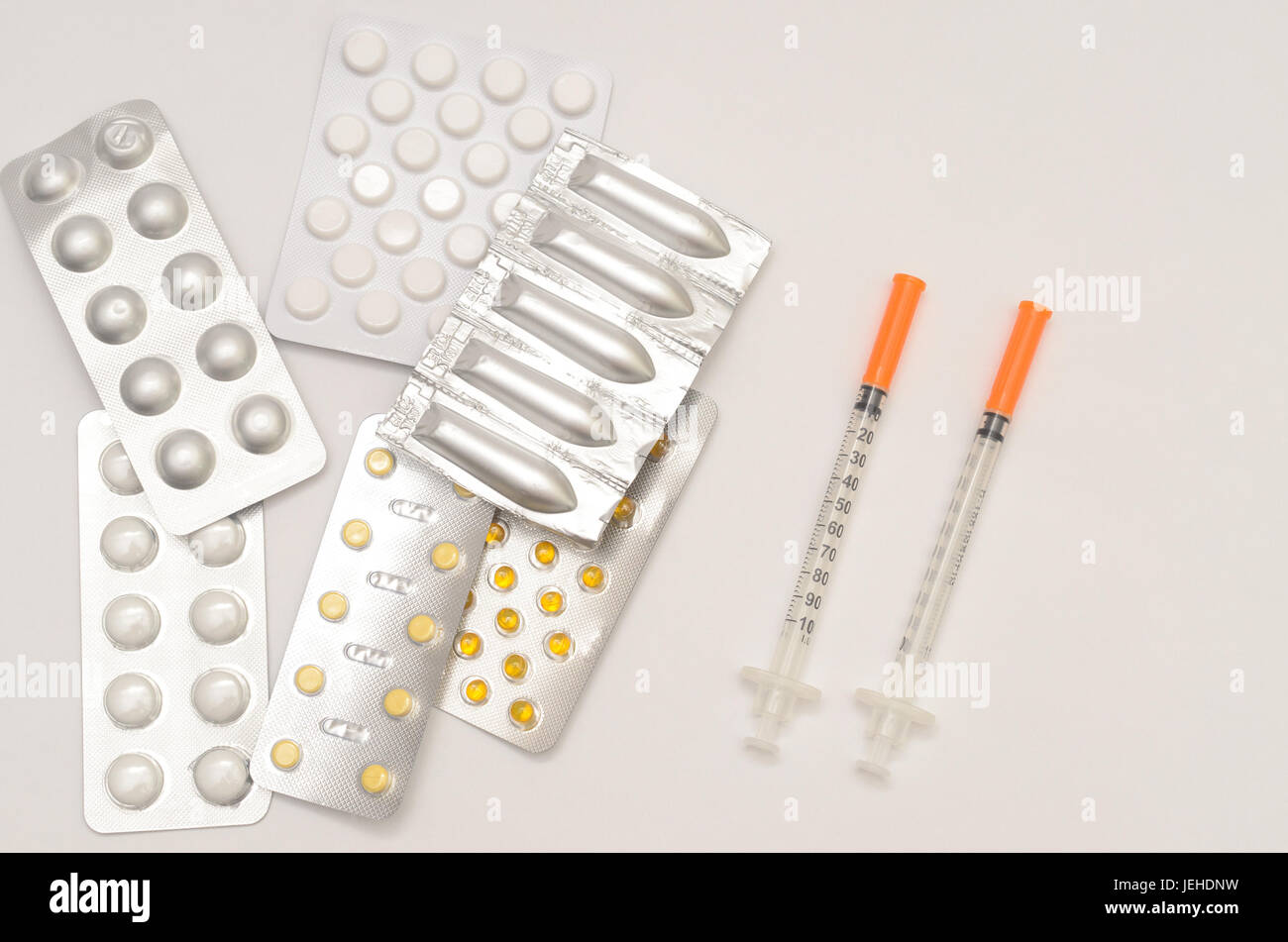 Contraceptive tablets in packages and without on a light background ...