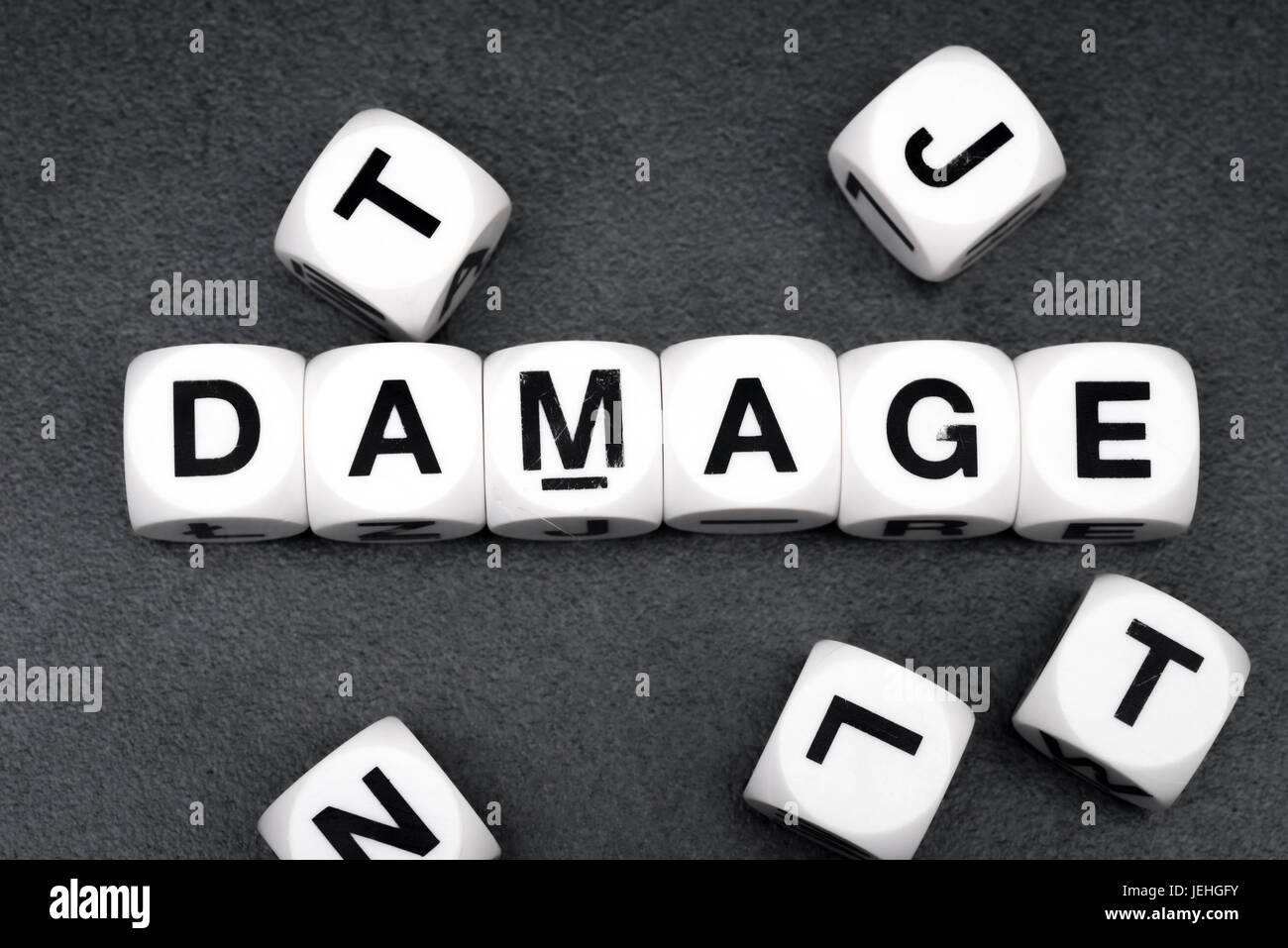 word damage on white toy cubes Stock Photo - Alamy