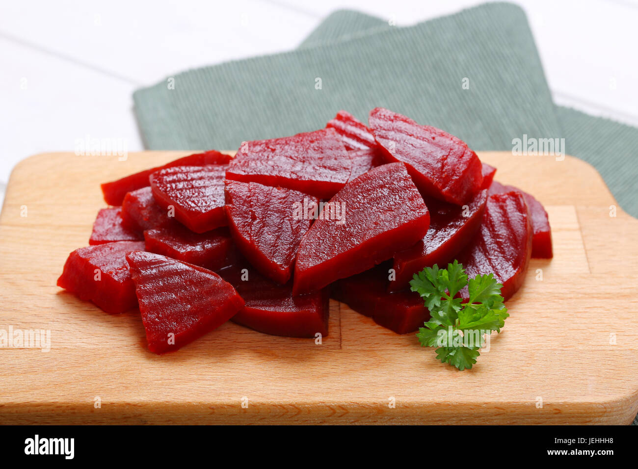 sliced and pickled beetroot on wooden cutting board - close up Stock ...