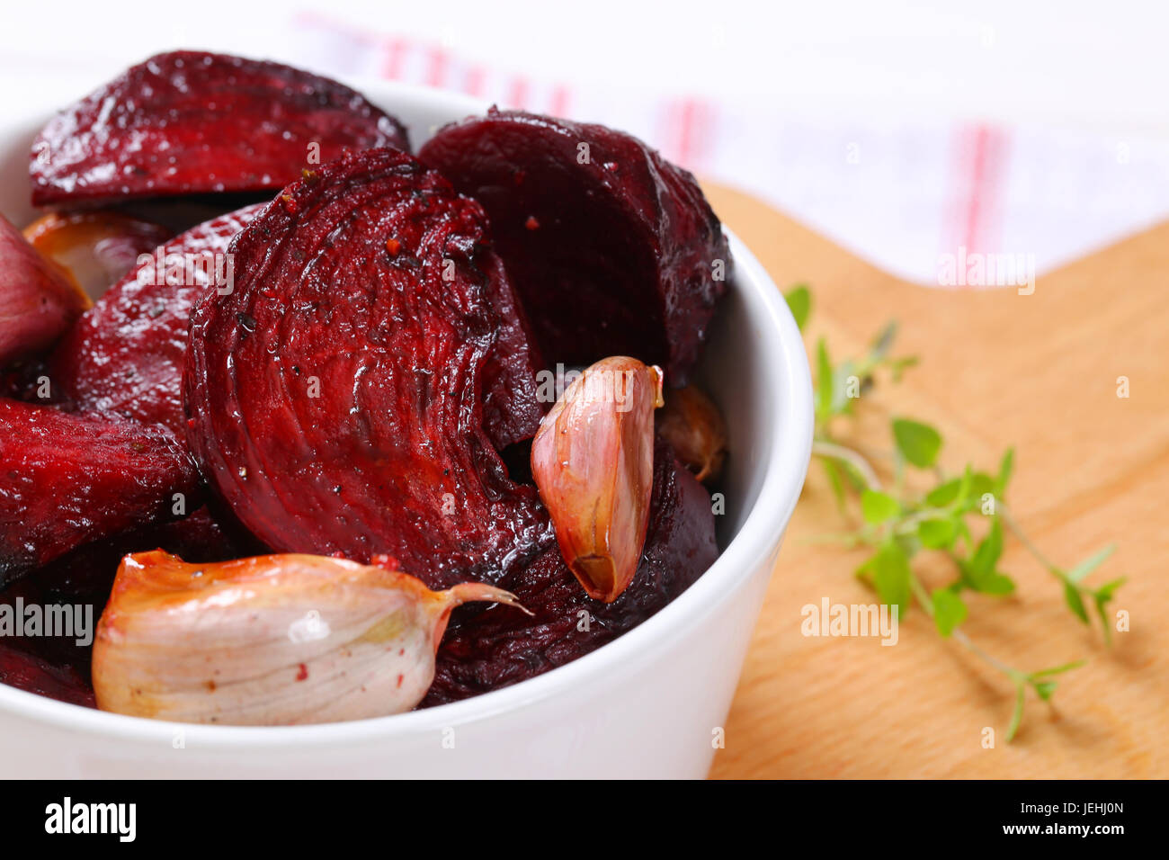bowl of baked beetroot and garlic - close up Stock Photo - Alamy
