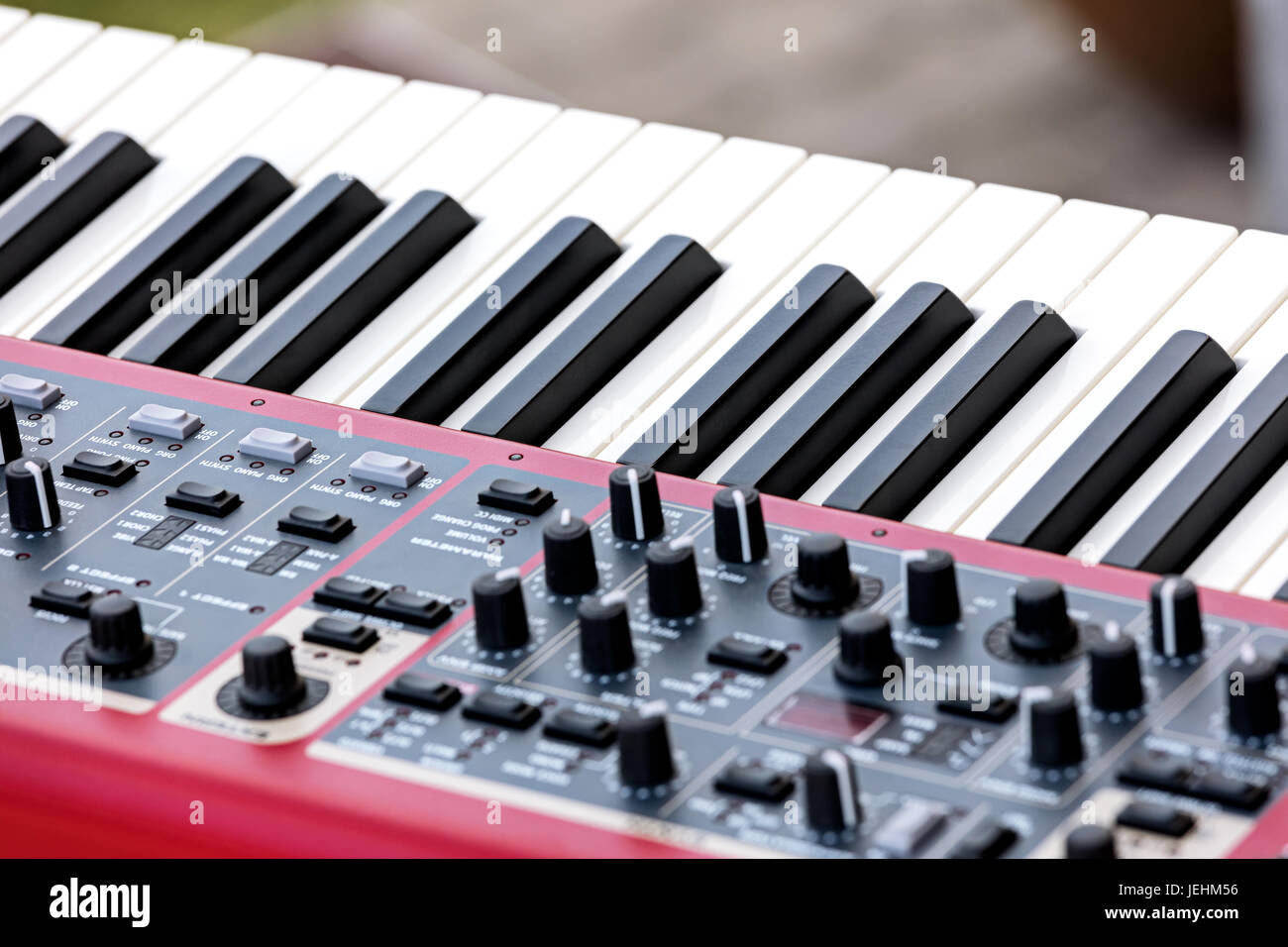 electronic synthesizer with keys, midi controller volume fader, knobs ...