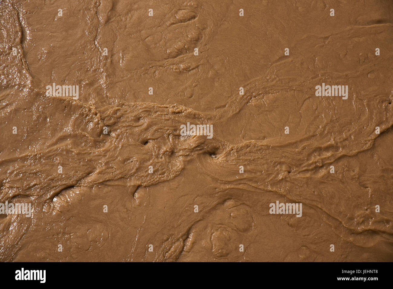 Muddy water flowing in the river after a rain storm Stock Photo - Alamy