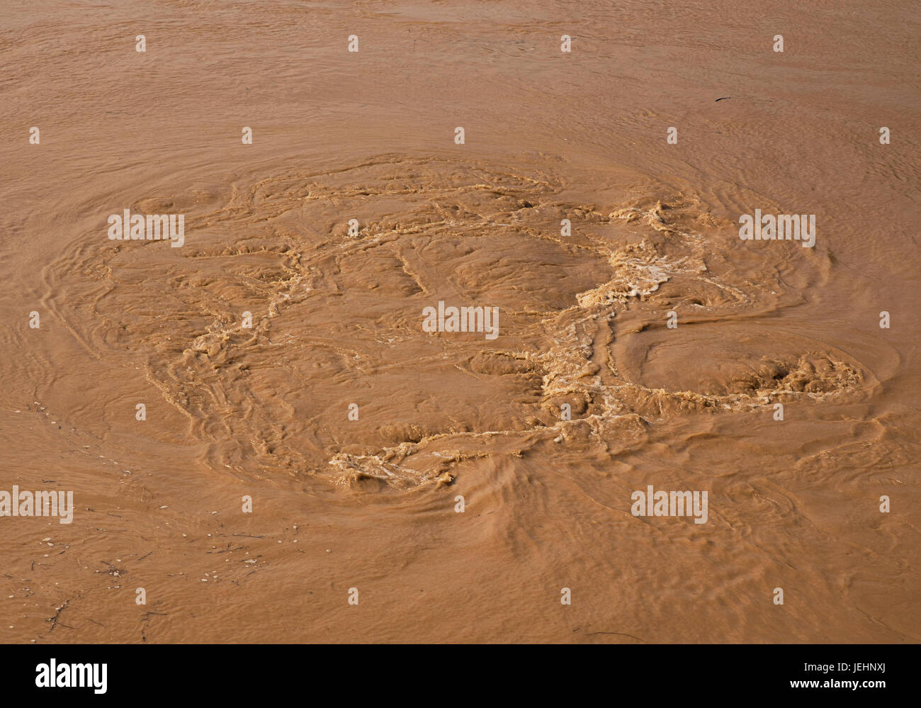 Muddy water flowing in the river after a rain storm Stock Photo - Alamy