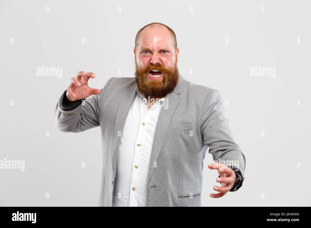 Screaming, furious man with beard Stock Photo - Alamy
