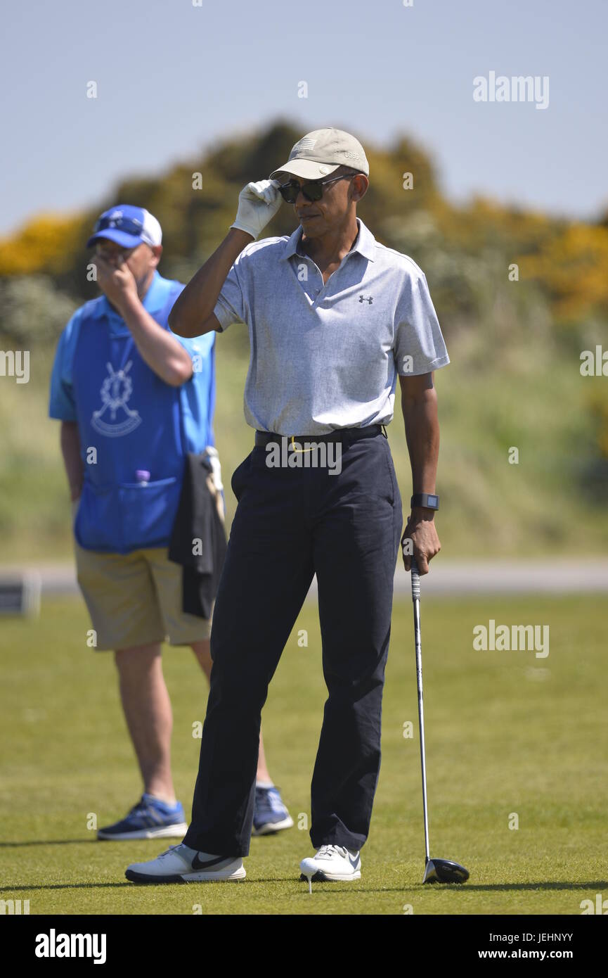 Former US president Barack Obama (light blue shirt) playing a round of ...