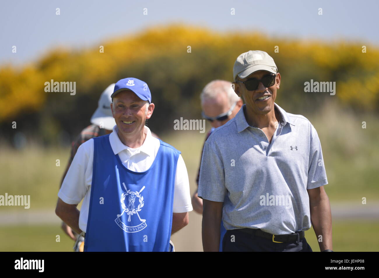 Former US president Barack Obama (light blue shirt) playing a round of ...