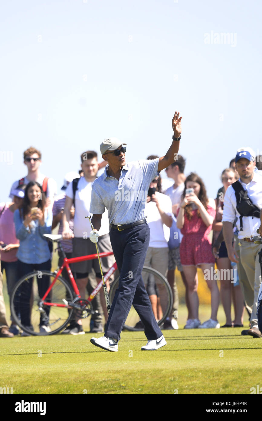 Former US president Barack Obama (light blue shirt) playing a round of ...