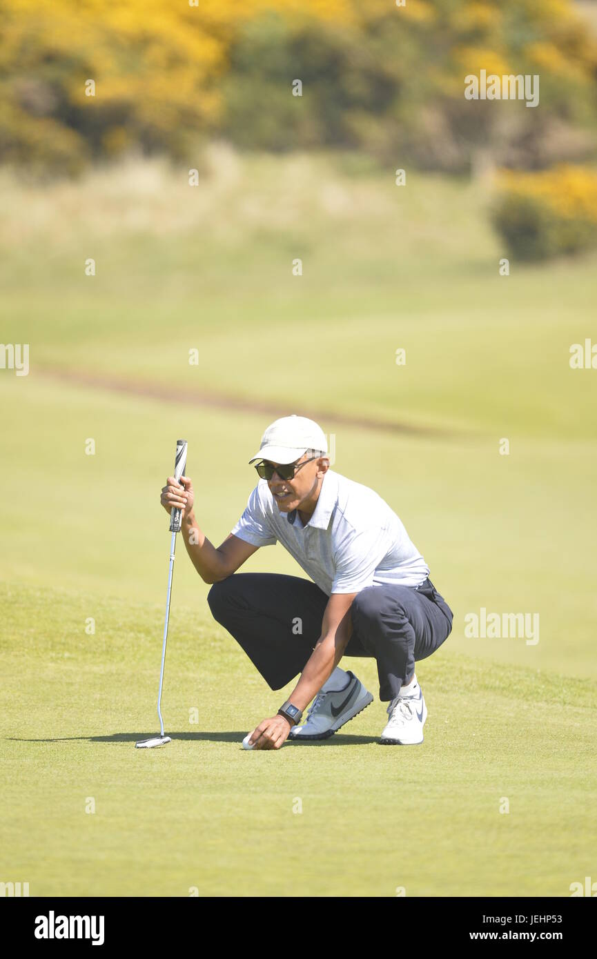 Former US president Barack Obama (light blue shirt) playing a round of ...