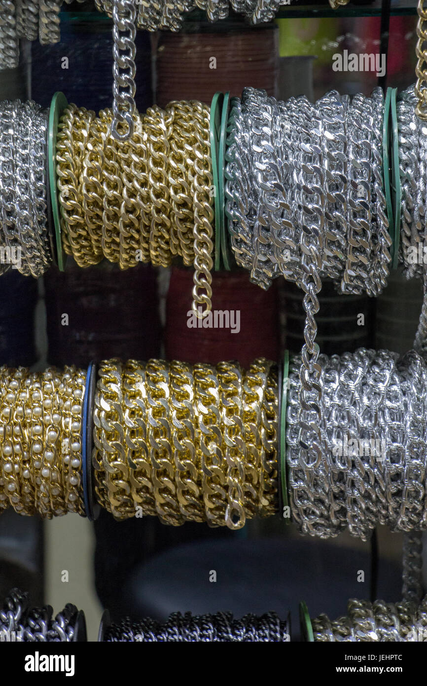 Rolls of decorative chains in view Stock Photo - Alamy