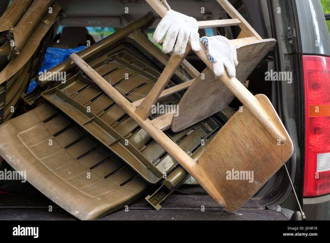 Car boot loaded with old furniture, cropped outdoor photo Stock Photo ...