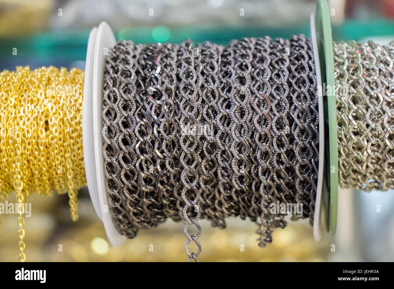 Rolls of decorative chains in view Stock Photo - Alamy
