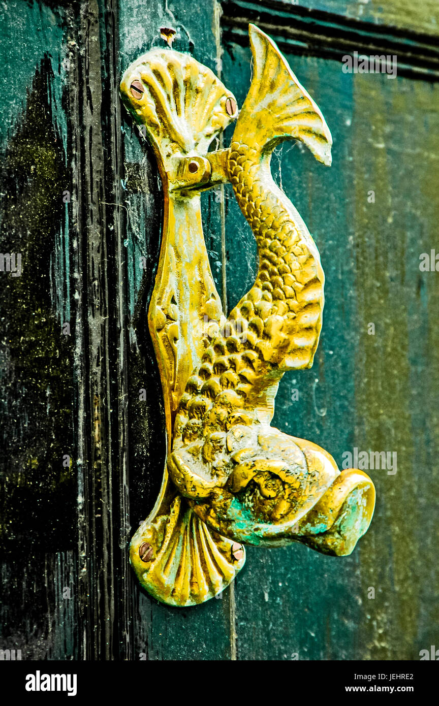 Brass fish shaped door knocker hi-res stock photography and images - Alamy