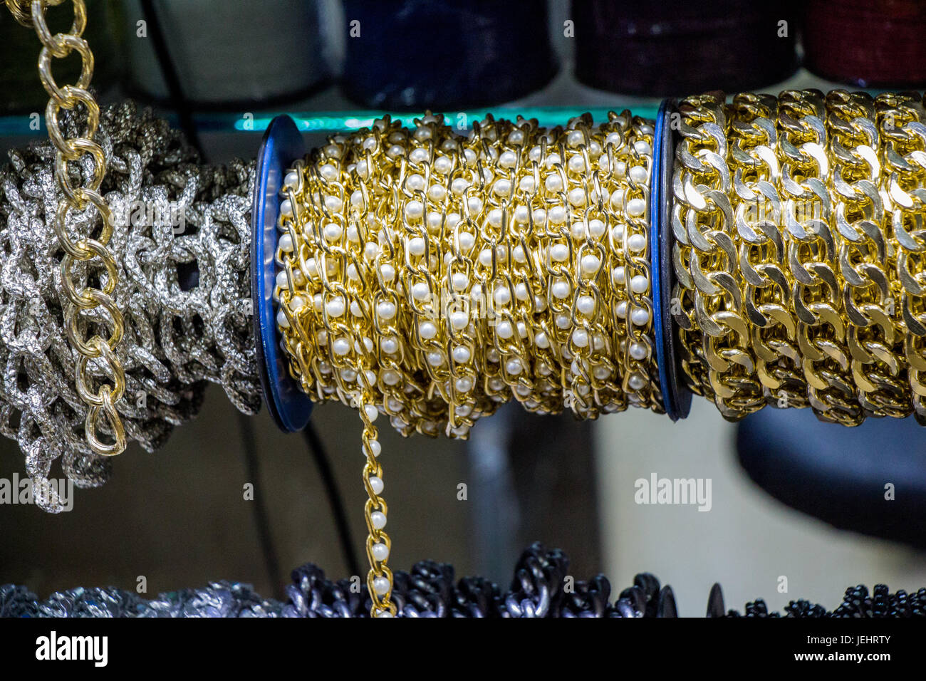 Rolls of decorative chains in view Stock Photo - Alamy