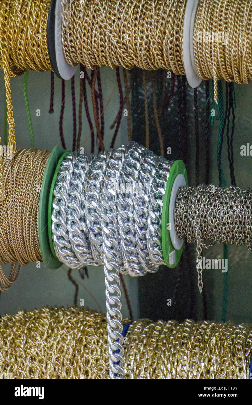 Rolls of decorative chains in view Stock Photo - Alamy