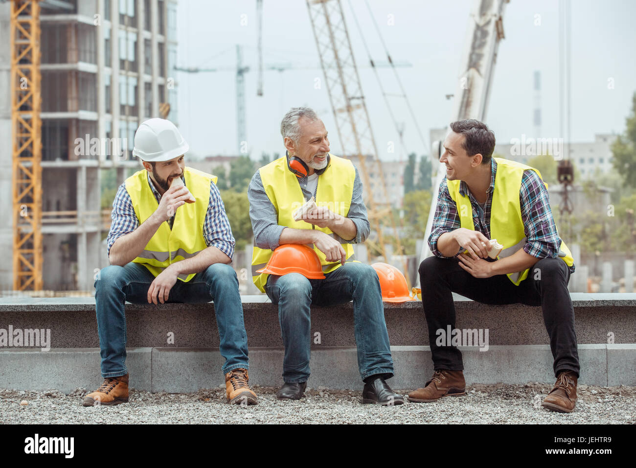 Worker helmet eating man hi-res stock photography and images - Alamy