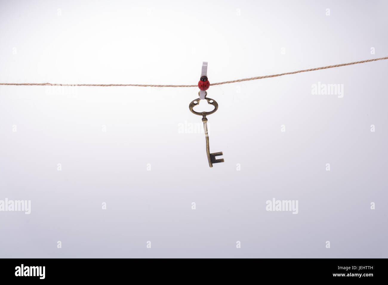 Retro styled golden color key forms the word key Stock Photo - Alamy