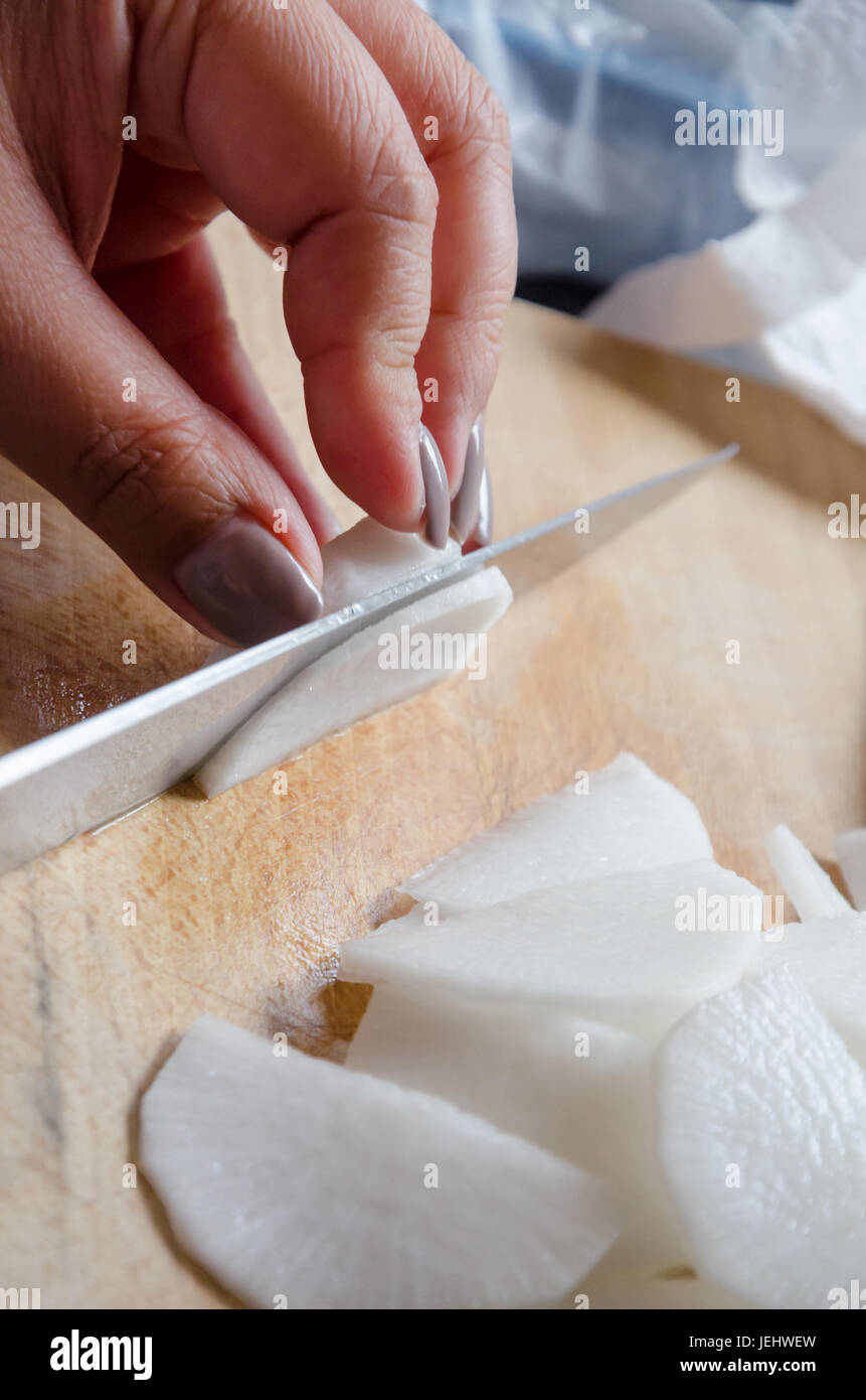 Cutting white radish sharp knife hi-res stock photography and images ...
