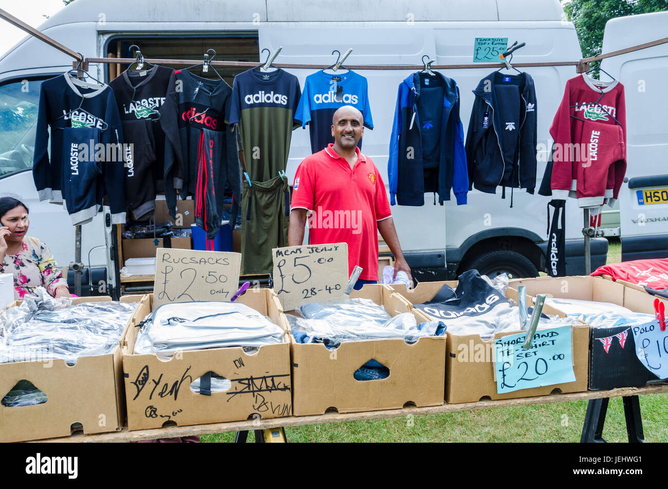 A man poses for the camera at his car boot sale stall Stock Photo - Alamy