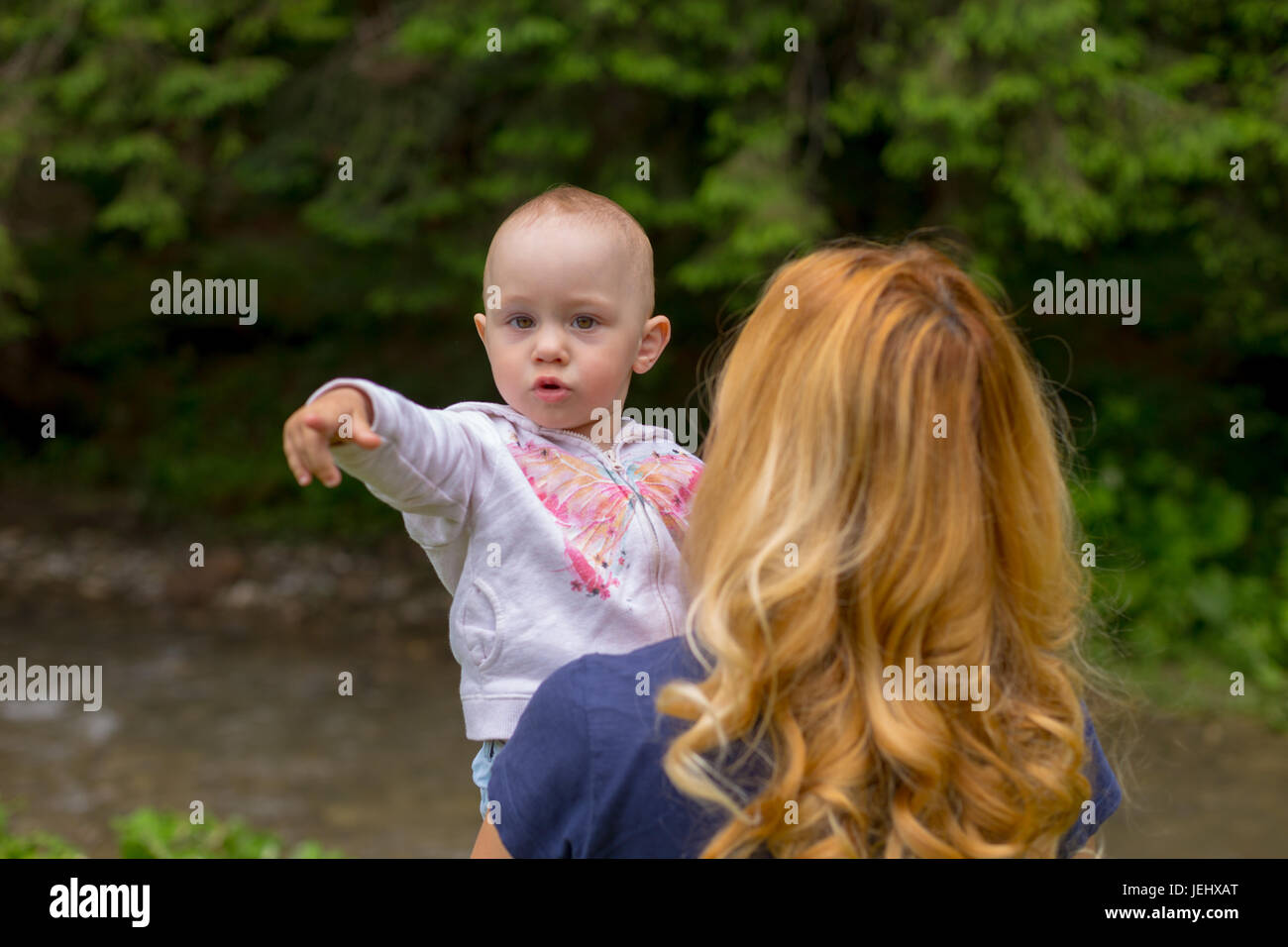 Kid pointing laughing hi-res stock photography and images - Alamy