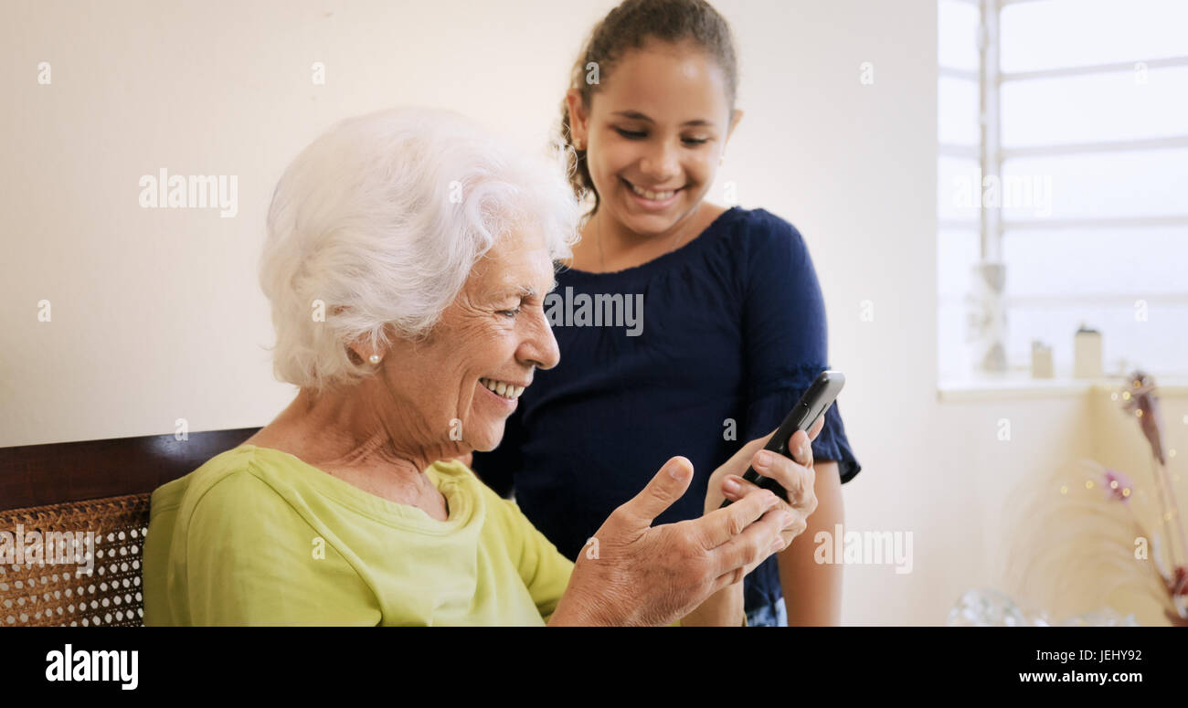 Family relationship with grandmother and granddaughter. Happy old woman ...
