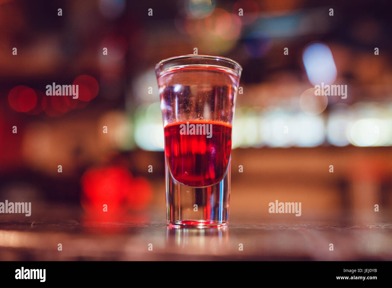 A cocktail made by layers. Shot at the bar Stock Photo - Alamy