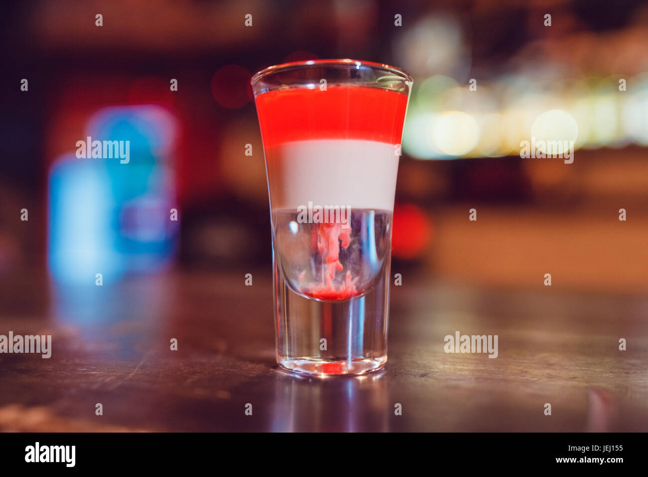 A cocktail made by layers. Shot at the bar Stock Photo - Alamy