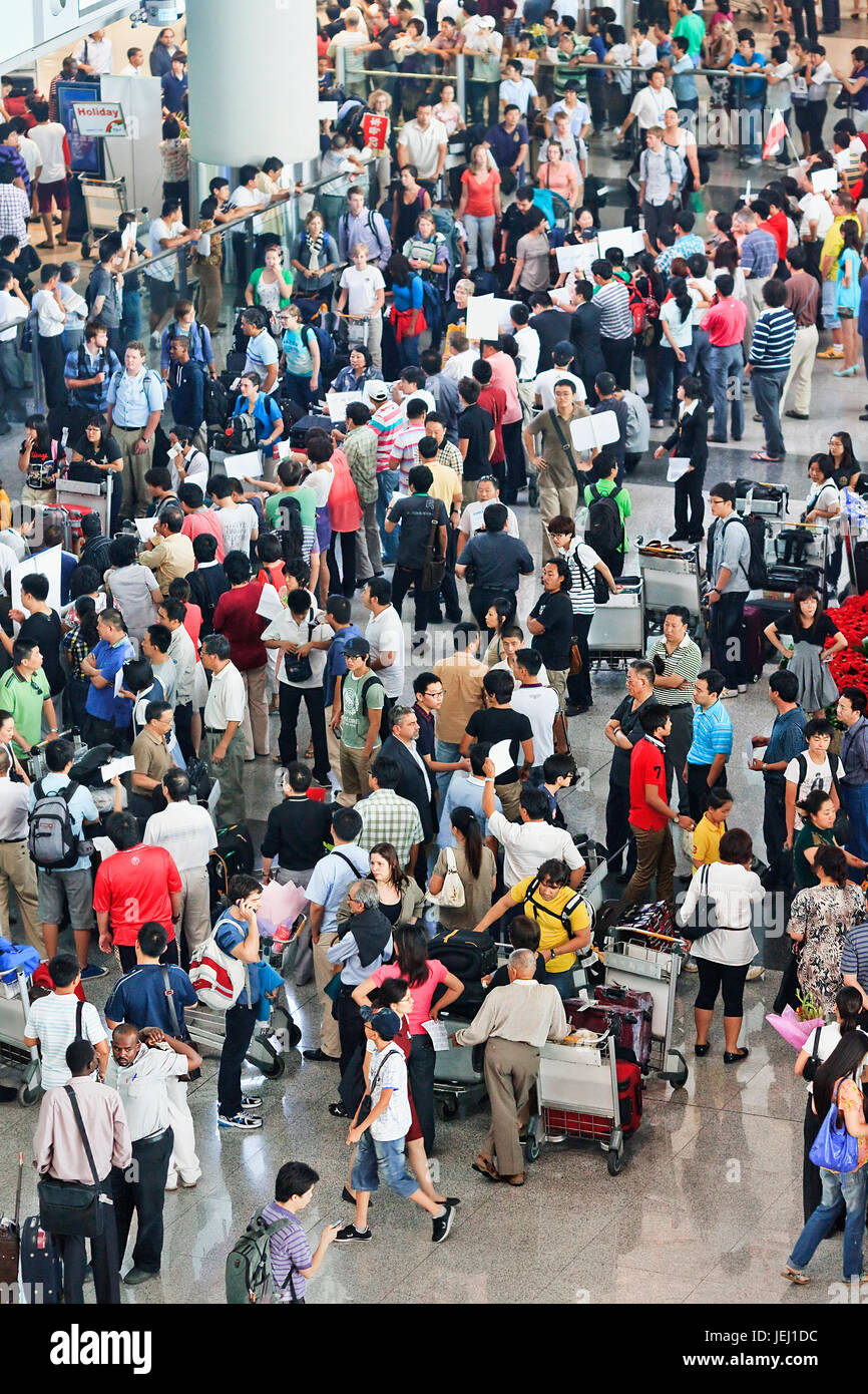 BEIJING–AUG. 30, 2010. Crowd in arrival hall at Beijing Capital ...