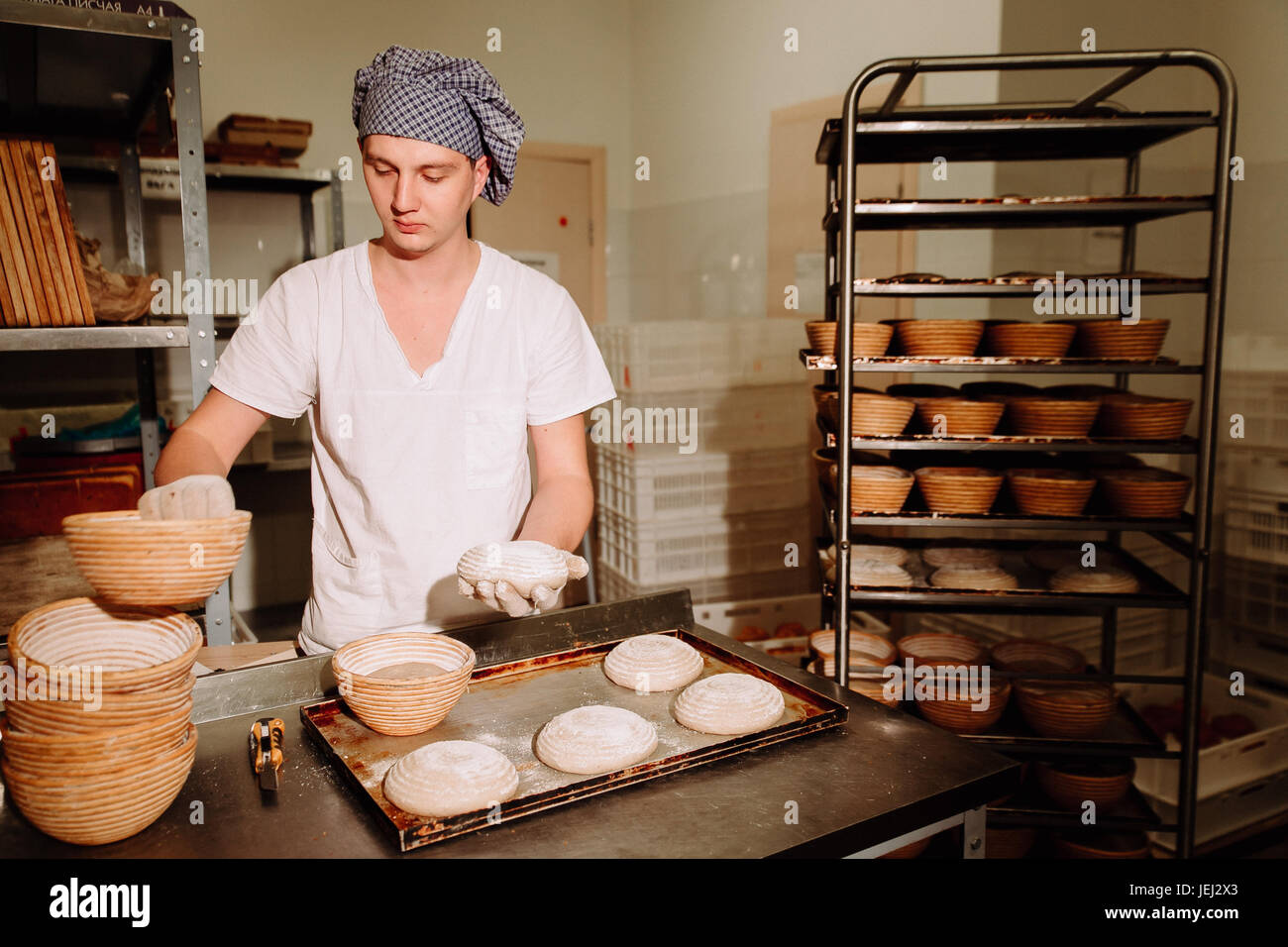 Hands of baker forming bread from dough Stock Photo - Alamy