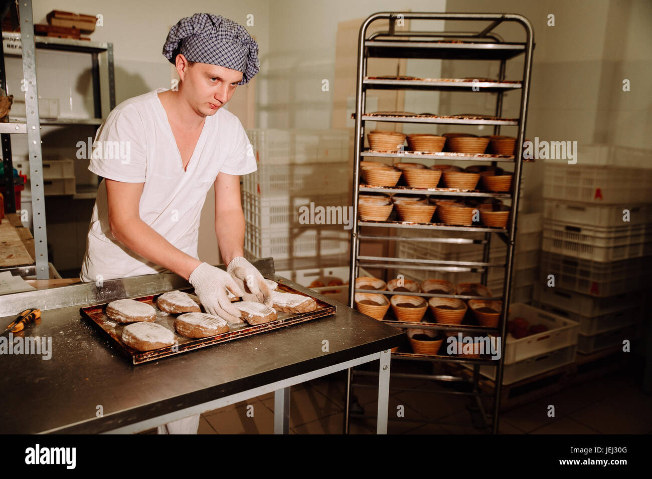 male cook shaping dough for baking bread Stock Photo - Alamy