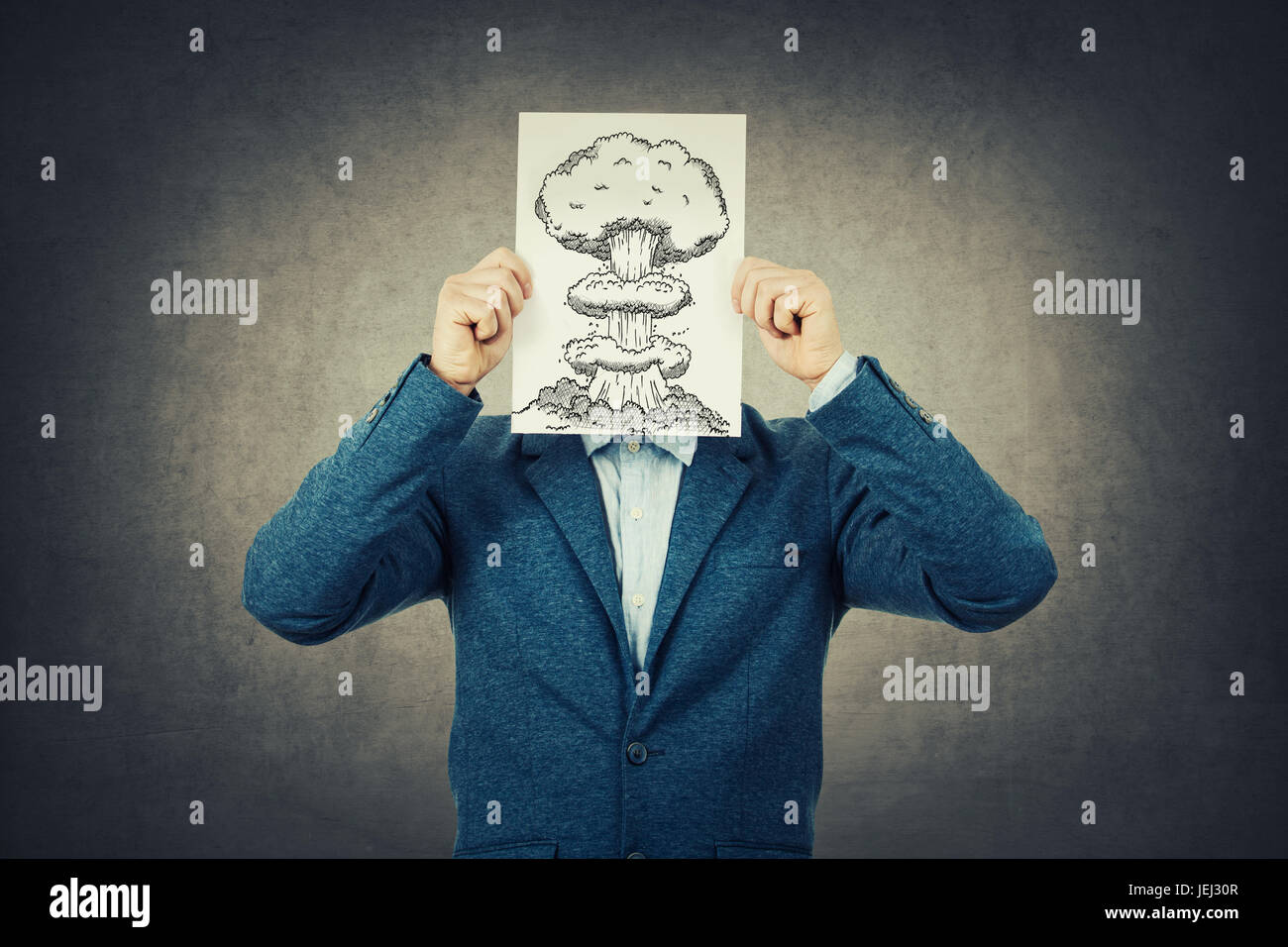Head explosion of Young businessman holding a white paper over his head ...