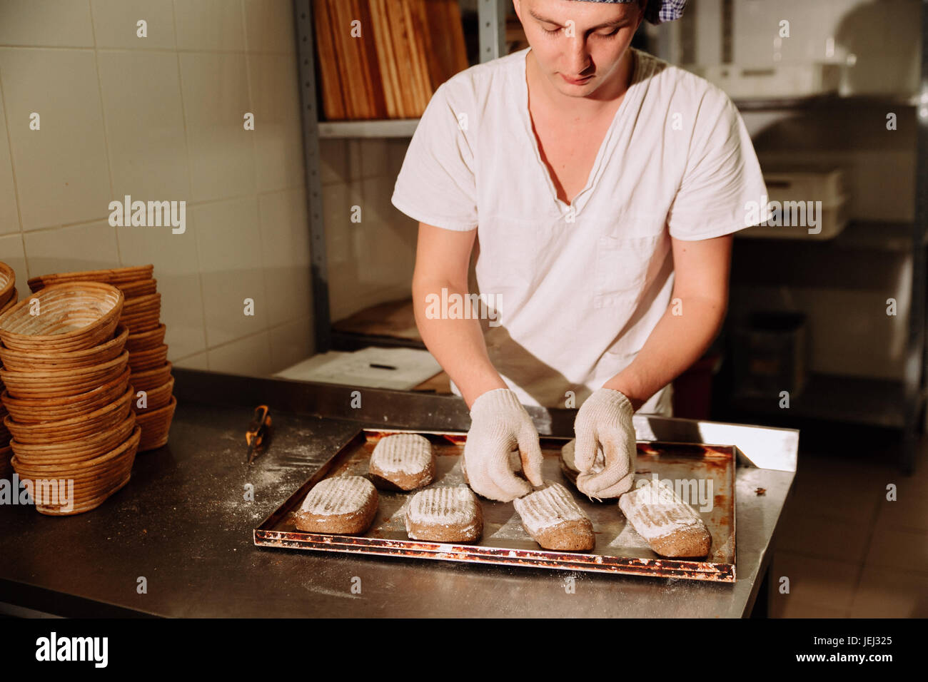 Proving dough of bran in basket. Private Bakery. Production bread Stock ...