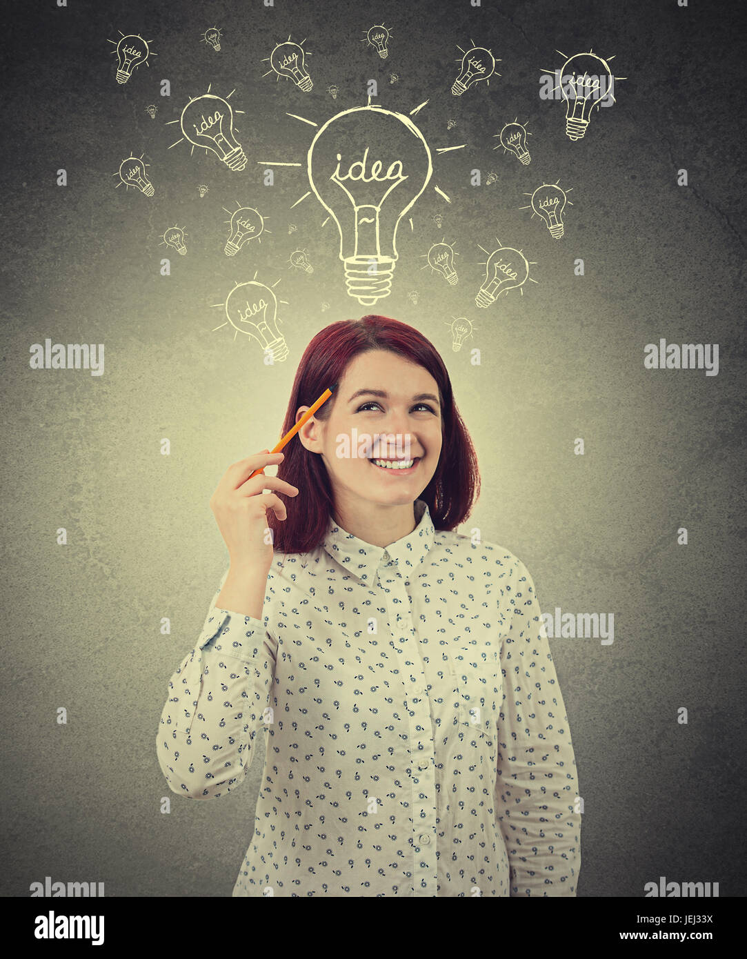 Self development. Young smiling student girl businesswoman looking up ...