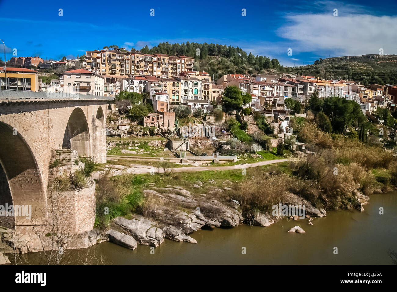Arched bridge leading to small town in northern Spain Stock Photo - Alamy