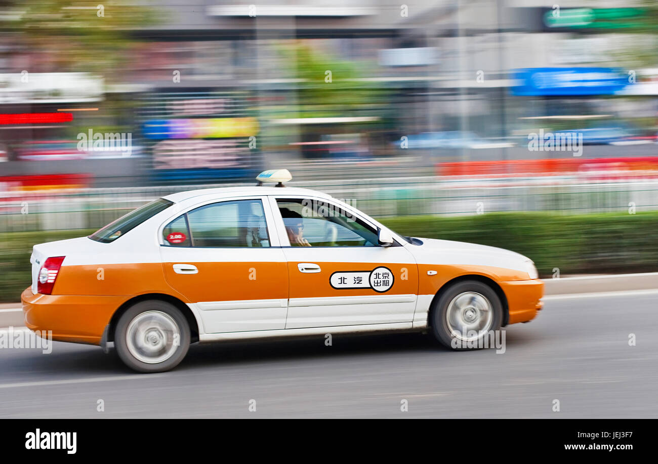 BEIJING–OCT. 28, 2011. Taxi in Beijing city center. Taxi is a very ...